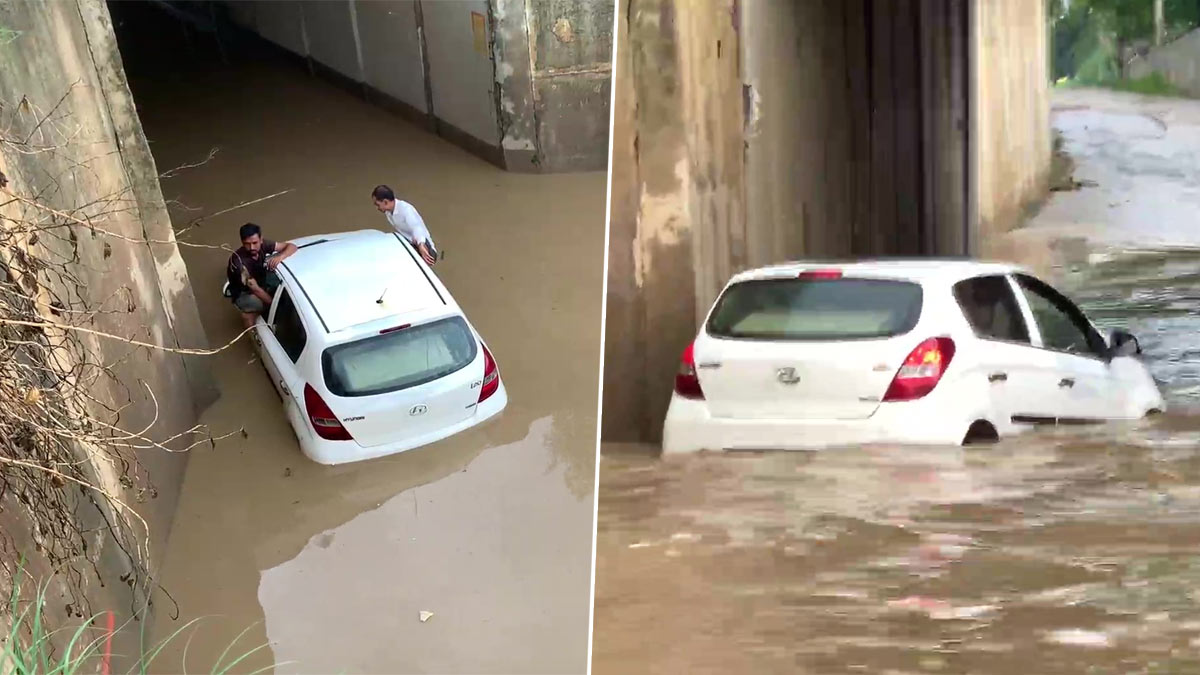 UP: हापुड़ के रेलवे अंडरपास में भरे पानी में एक कार फंसी, SDM ने कहा ...